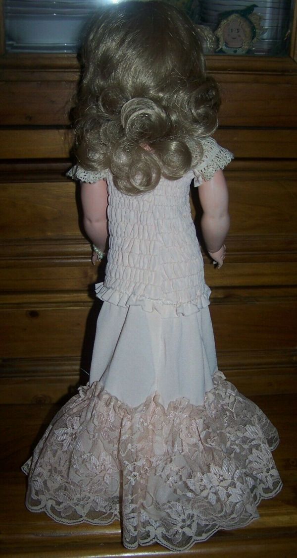 UNKNOWN DOLL WITH HARD PLASTIC WALKER BODY AND VINYL HEAD | #64177792